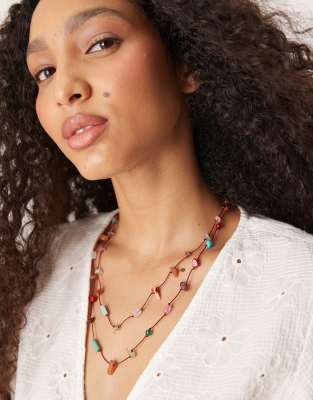 ASOS DESIGN multirow long necklaces with chipping detail in red | ASOS