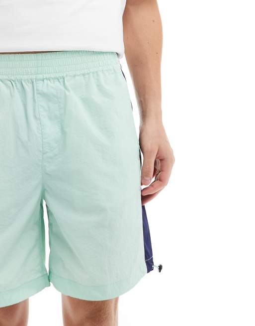 ASOS DESIGN nylon shorts in mint and navy side panels | ASOS