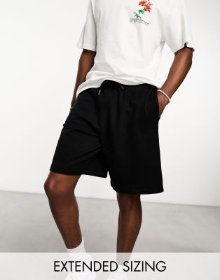 ASOS DESIGN oversized jersey shorts in black | ASOS
