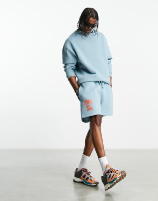 ASOS DESIGN oversized shorts in blue with multiplacement puff print ...