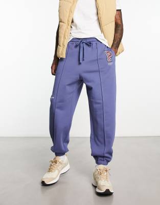 ASOS DESIGN oversized trackies in navy with collegiate multiplacement ...