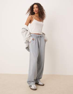 ASOS DESIGN oversized trackies with turnback hem detail in washed blue ...