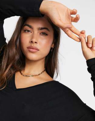 ASOS DESIGN oversized v neck batwing sleeve top in drapey rib in black ...