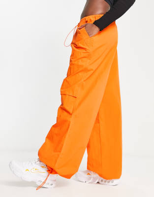 ASOS DESIGN parachute cargo pants in orange | ASOS