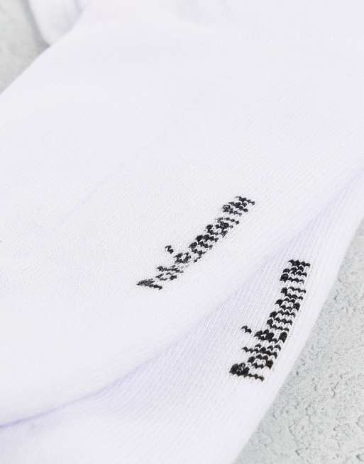 ASOS DESIGN Pokemon Psyduck sports sock in white | ASOS