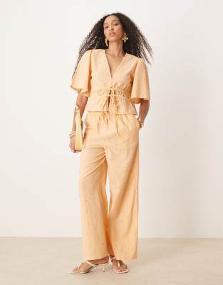 ASOS DESIGN pull on floral embroidery pants in apricot - part of a set ...
