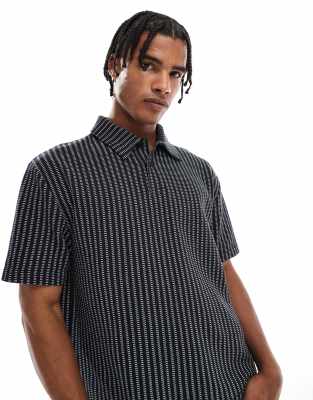 ASOS DESIGN relaxed boxy striped polo in black and white | ASOS