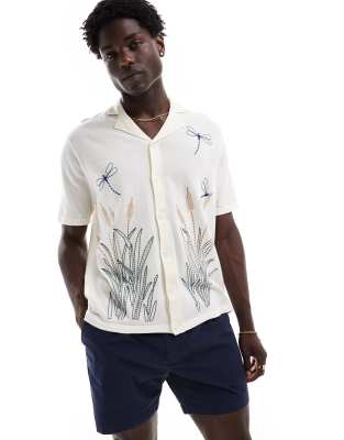 ASOS DESIGN relaxed knit button up polo with dragonfly embroidery in ...
