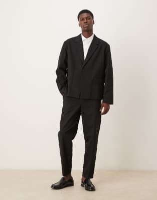ASOS DESIGN relaxed tapered suit trousers in black cotton | ASOS