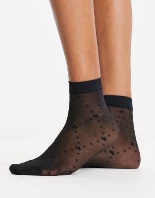 ASOS DESIGN sheer socks with star and dot design in black | ASOS