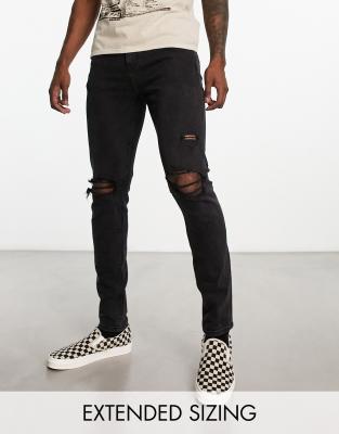 ASOS DESIGN skinny jeans with rips in black | ASOS