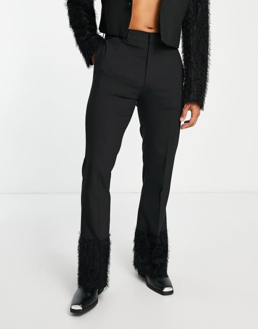 ASOS DESIGN skinny lowrise flares with fringing in black | ASOS