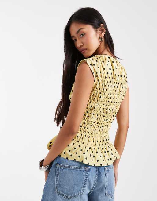 ASOS DESIGN sleeveless shirred top in yellow polka dot | ASOS