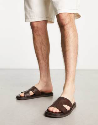 ASOS DESIGN slip on sandals in brown monogram print | ASOS