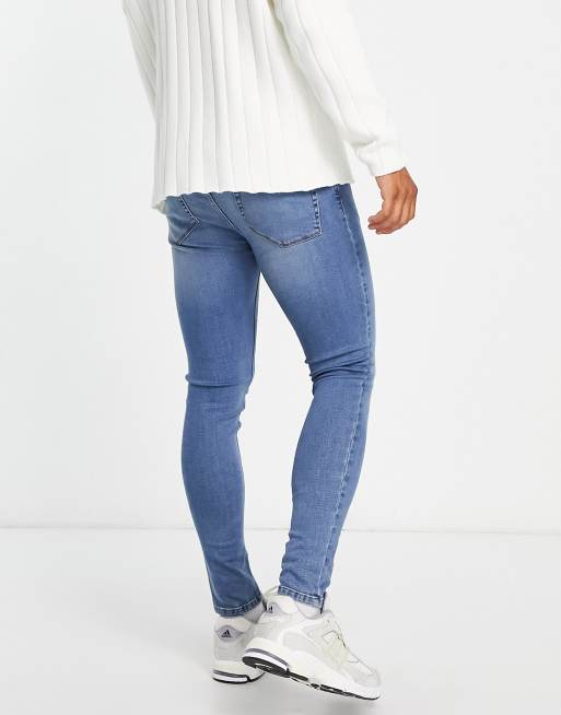 ASOS DESIGN spray on jeans with power stretch in mid wash blue | ASOS