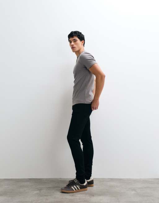 ASOS DESIGN spray on jeans with powerstretch in black | ASOS