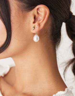 ASOS DESIGN stud earrings with front-to-back faux pearl design in gold ...