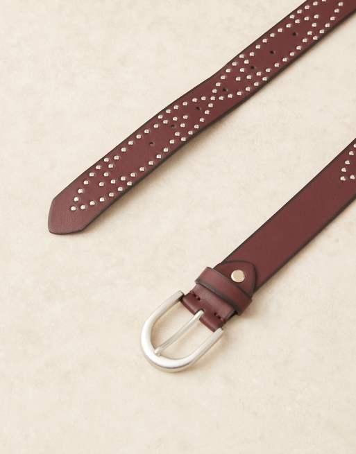 ASOS DESIGN studded burnished belt in burgundy | ASOS