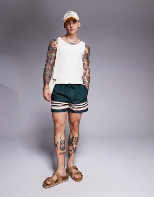 ASOS DESIGN swim shorts in short length in green with border stripe | ASOS