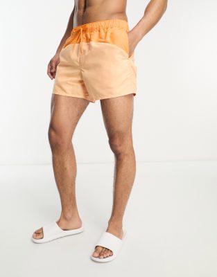 ASOS DESIGN swim shorts in short length with cut-and-sew in orange | ASOS