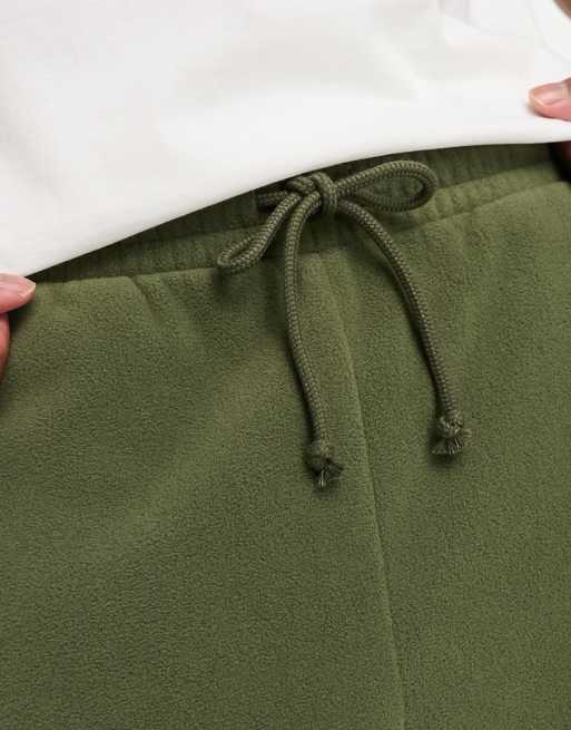 ASOS DESIGN tapered fleece sweatpants in green | ASOS