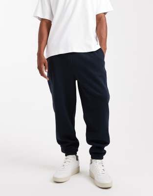 ASOS DESIGN tapered trackies in navy | ASOS