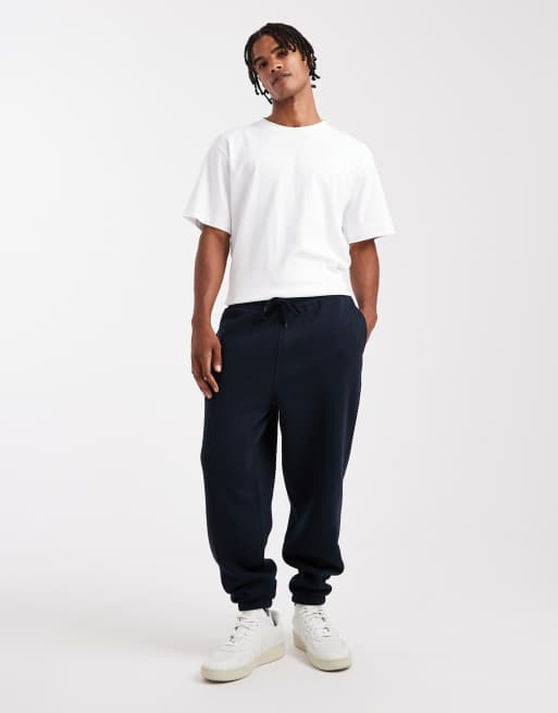 ASOS DESIGN tapered trackies in navy | ASOS