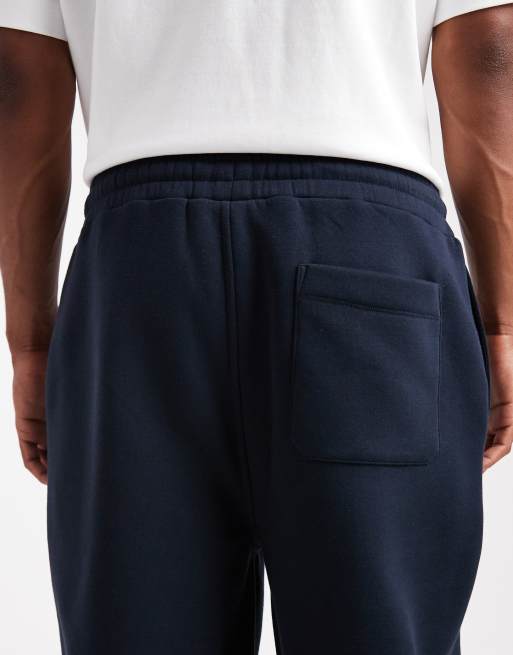 ASOS DESIGN tapered trackies in navy | ASOS
