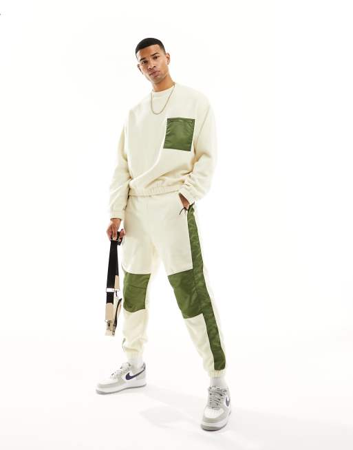 ASOS DESIGN tapered trackies set in off white polar fleece with nylon ...