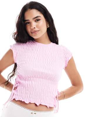 ASOS DESIGN textured short sleeve top with tie sides in pink | ASOS