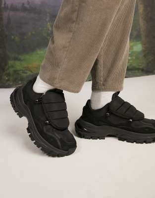 ASOS DESIGN trainers with tech details and padded bag in black | ASOS