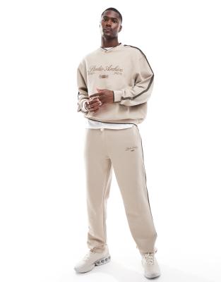 ASOS DESIGN wide leg joggers with taping detail in beige | ASOS