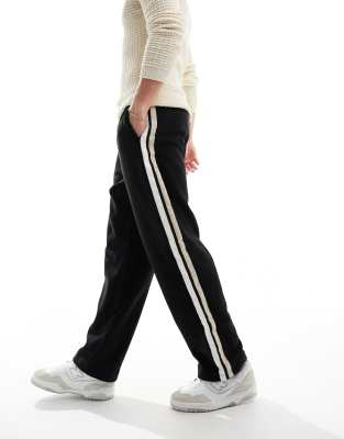 ASOS DESIGN wide leg trackies in black polar fleece with side stripe | ASOS