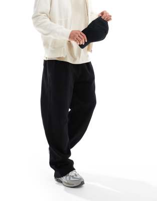 ASOS DESIGN wide leg trackies with front pleat in black | ASOS