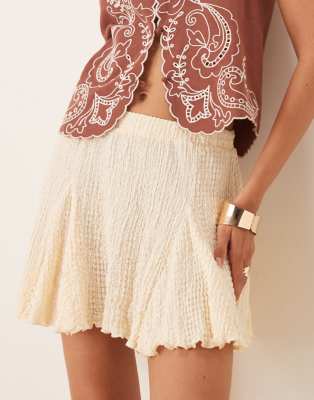 ASOS DESIGN - Zwierige mini rok met textuur en godet-plooien in ...