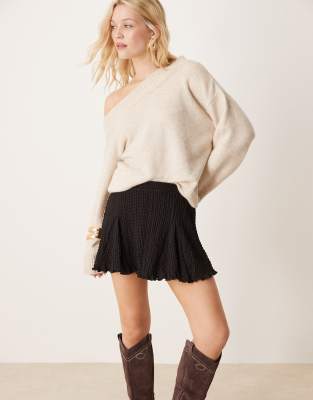 ASOS DESIGN - Zwierige mini rok met textuur en godet-plooien in zwart ...