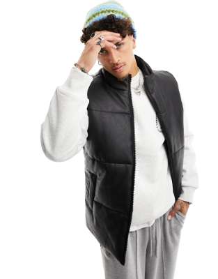 ASOS DESIGNS puffer vest in faux leather in black | ASOS