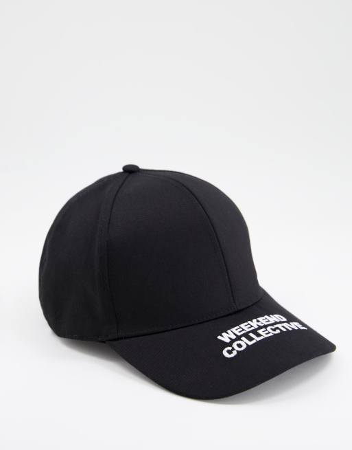 ASOS Weekend Collective baseball cap with embroidered motif in black | ASOS