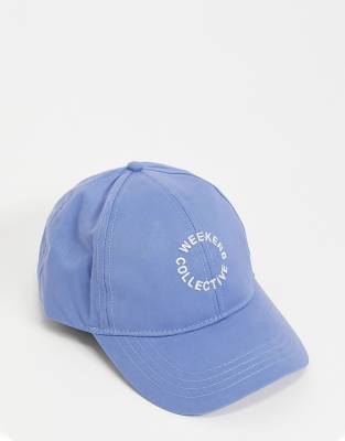 ASOS Weekend Collective baseball cap with logo in blue | ASOS