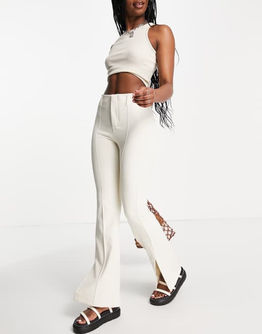 Bershka Split Hem Flared Tailored Trouser In Ecru Asos