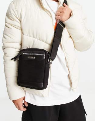 Bolongaro Trevor canvas and leather trim crossbody bag in black | ASOS