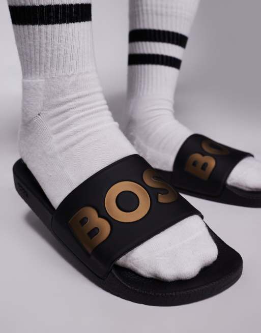 BOSS Aryeh contrast logo sliders in black and gold | ASOS