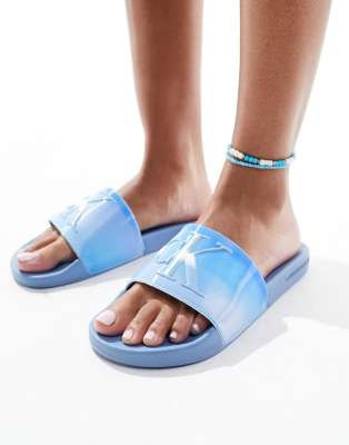 Calvin Klein Jeans monogram logo jelly sliders in blue | ASOS