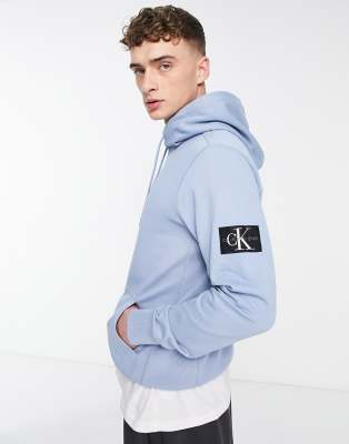 Calvin Klein Jeans monologo sleeve badge hoodie in light blue | ASOS
