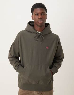 Calvin Klein Jeans – Premium – Mörkgrön huvtröja i frotté med liten ...
