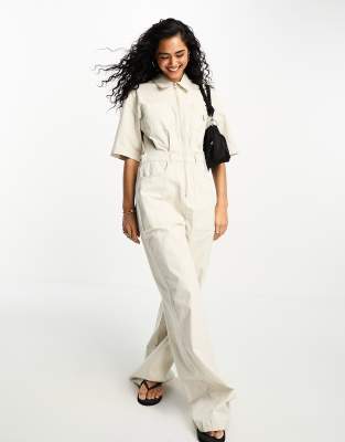 Calvin Klein Jeans - Tuta intera multitasche color crema con cut-out ...