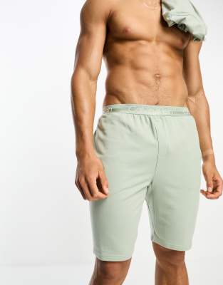 Calvin Klein sleep shorts in green | ASOS