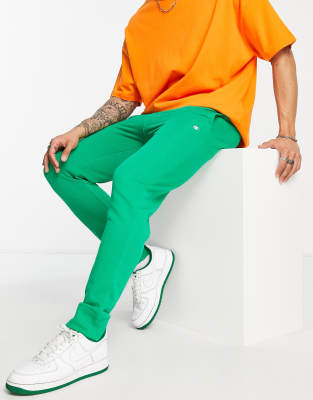 Champion – Gröna mjukisbyxor med liten logga | ASOS