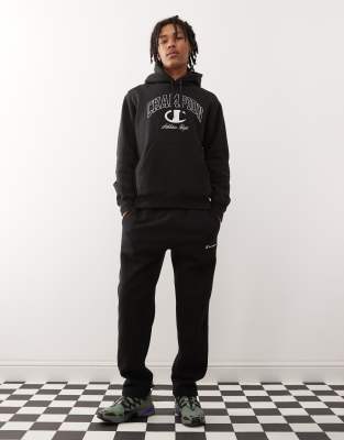 Champion hoodie and straight leg trackies tracksuit in black | ASOS