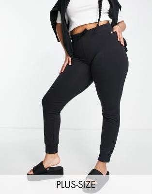 Champion Plus trackies in black | ASOS
